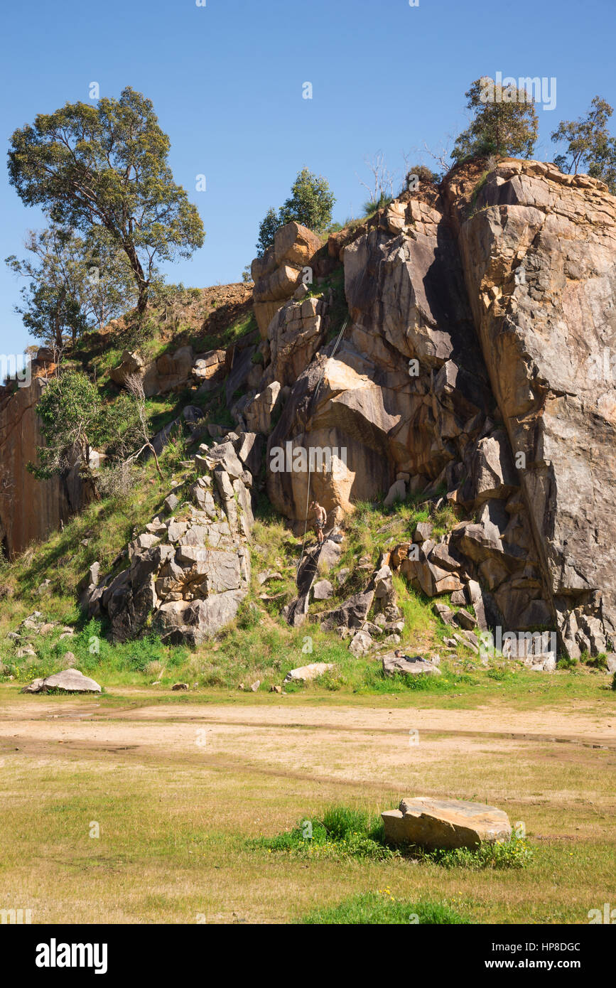 A man practicing rock climbing in a mountain quarry, Greenmount ...