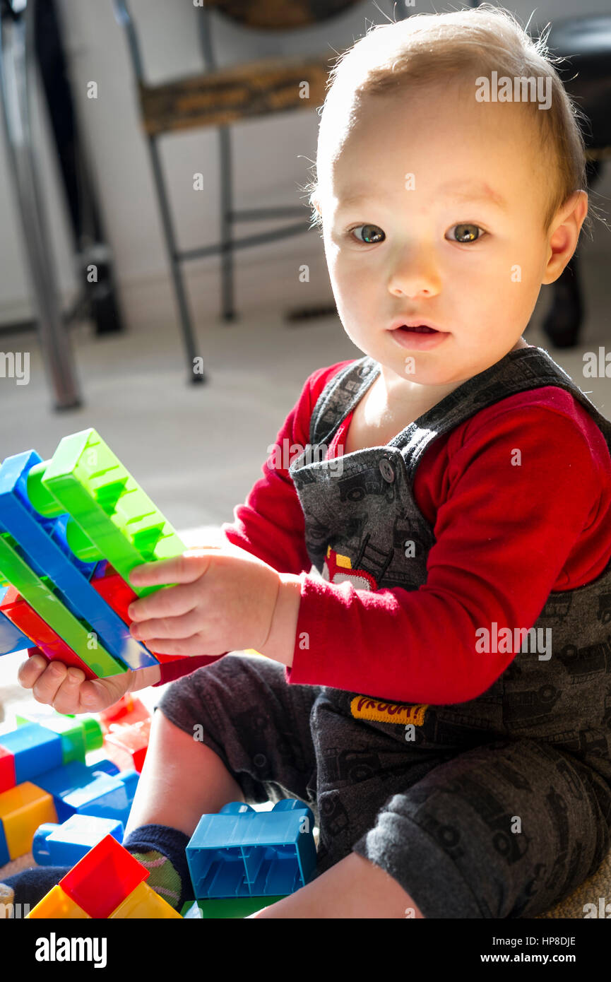 Baby boy playing bricks hi-res stock photography and images - Alamy