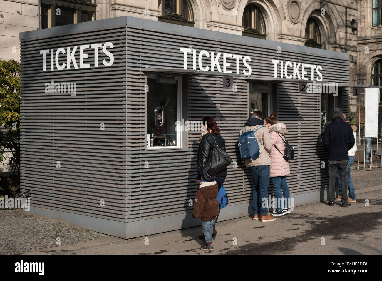 Berlin, Germany - February 19, 2017: People buying tickets at ticket ...