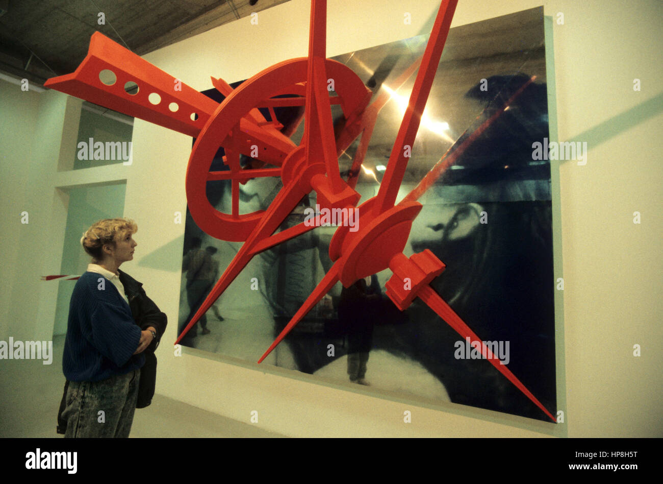 A visitor in front of an object by artist Robert Longo at the documenta ...