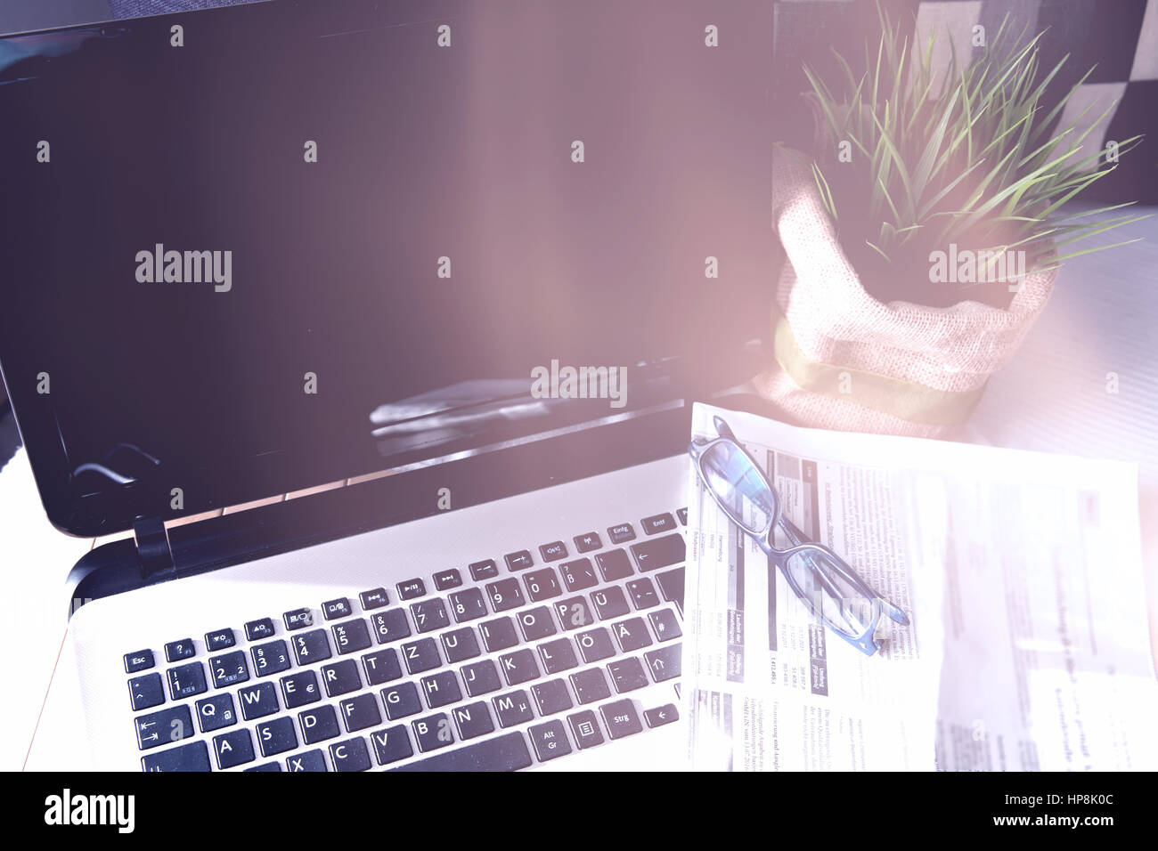 Newspaper with computer and glasses Stock Photo - Alamy
