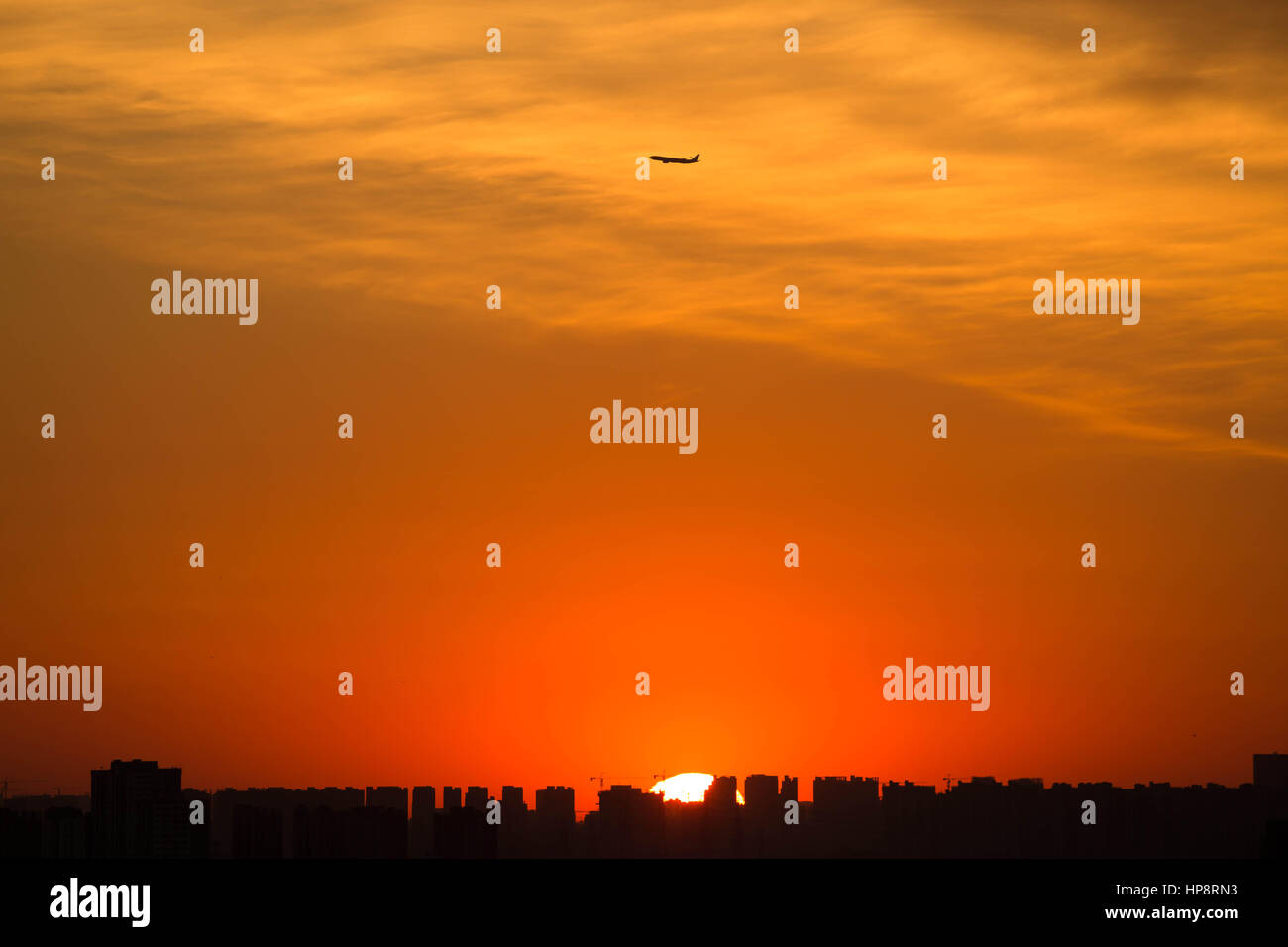 Beijing, China. 20th Feb, 2017. An airplane is seen against the morning ...