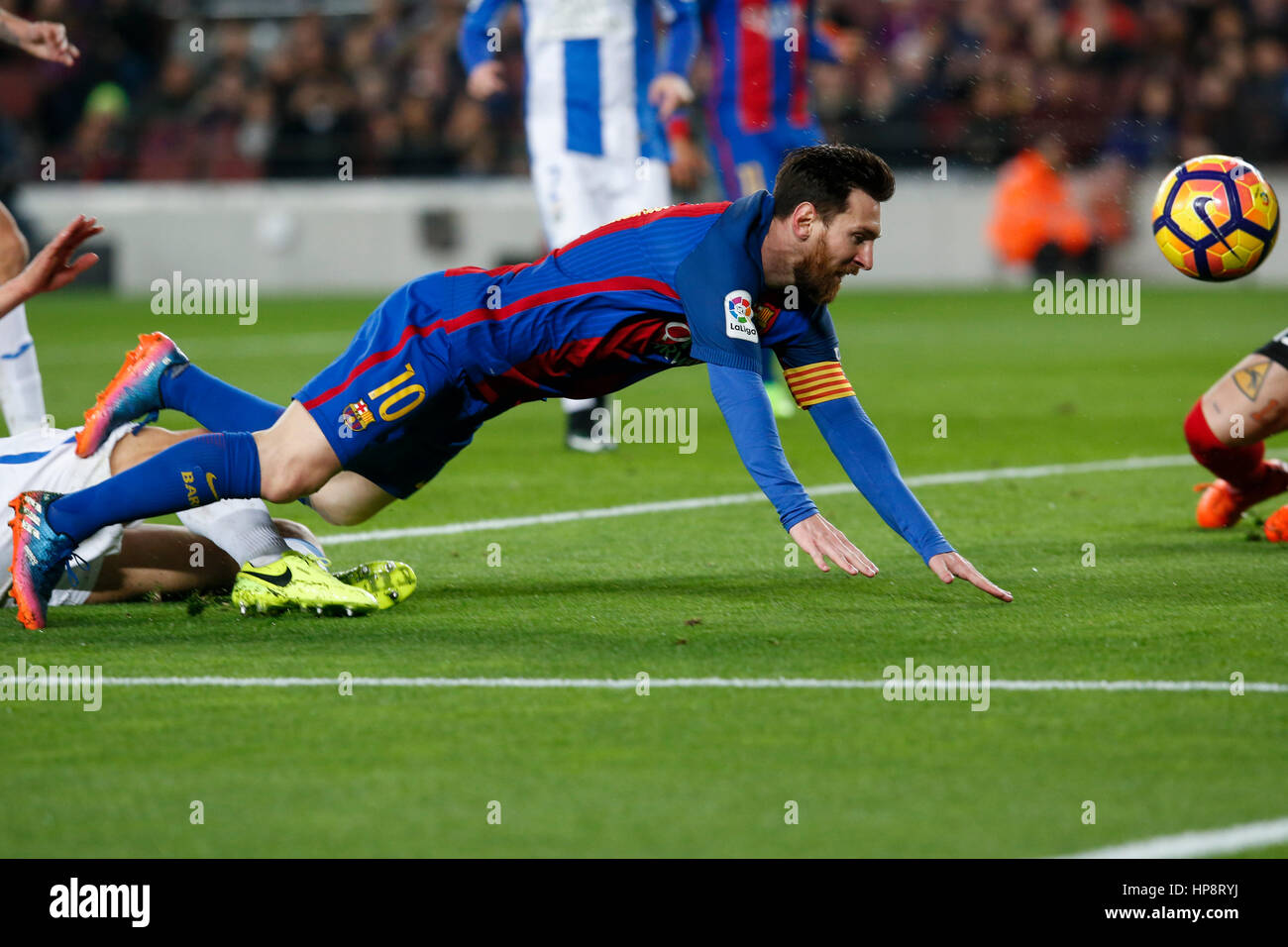 Barcelona, Spain. 19th Feb, 2017. Barcelona's Lionel Messi falls after ...