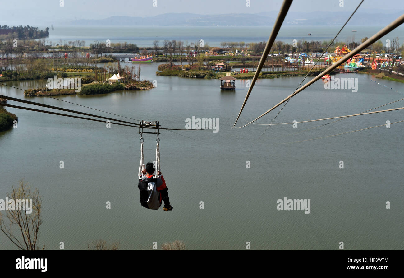 Kunming, China's Yunnan Province. 18th Feb, 2017. A tourist slides ...
