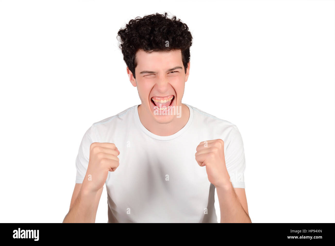 Portrait of a young latin man celebration victory. Isolated white ...