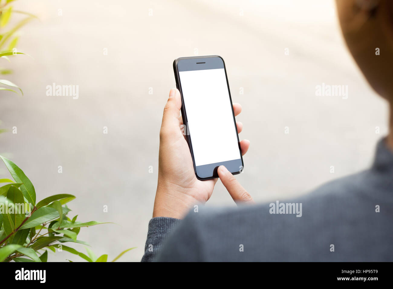 close-up phone mobile in woman hand holding and touch on blank screen ...