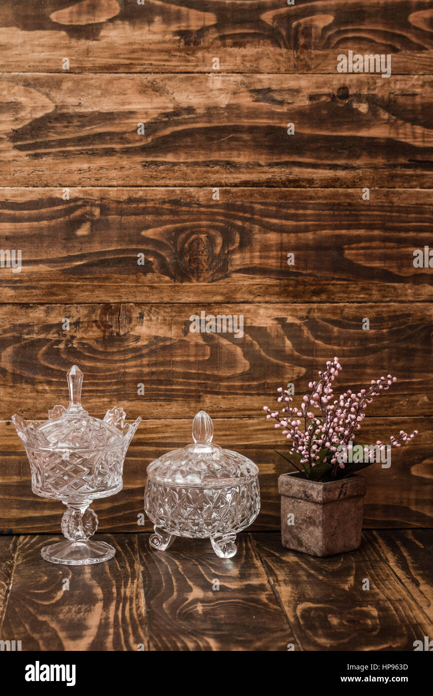 Empty classic crystal sweet bowl on brown wooden background with copy ...