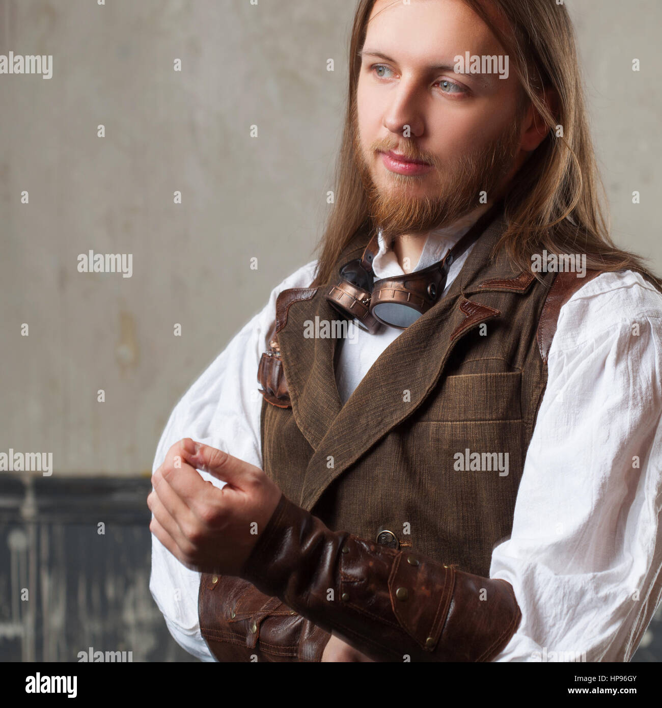 Handsome male Steam punk. Retro man portrait over grunge background ...