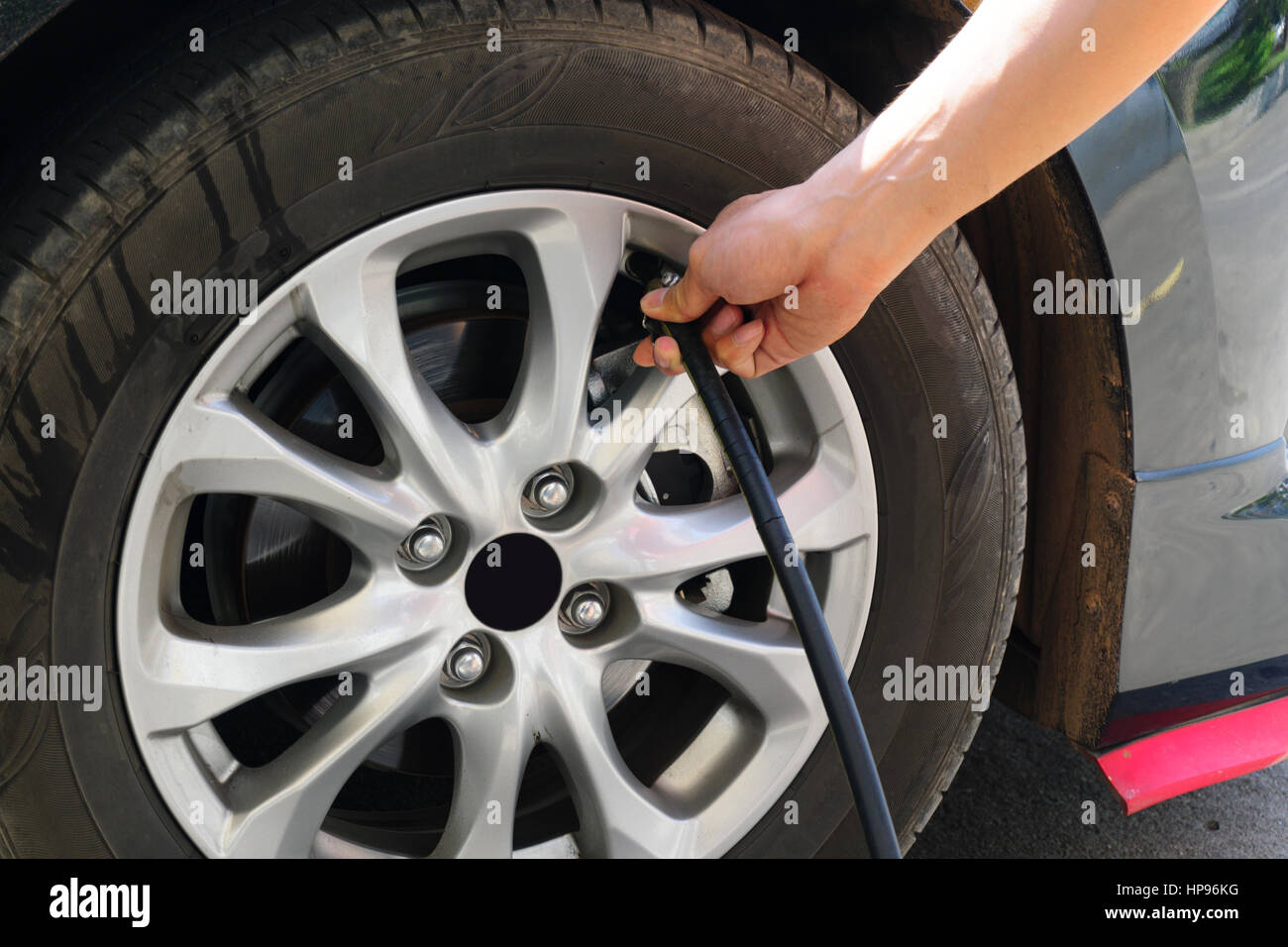 inflating the automobile wheels via a pump Stock Photo - Alamy