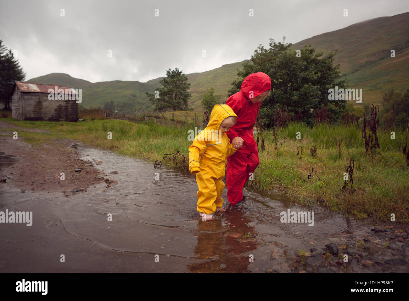 Children rain puddle hi-res stock photography and images - Alamy