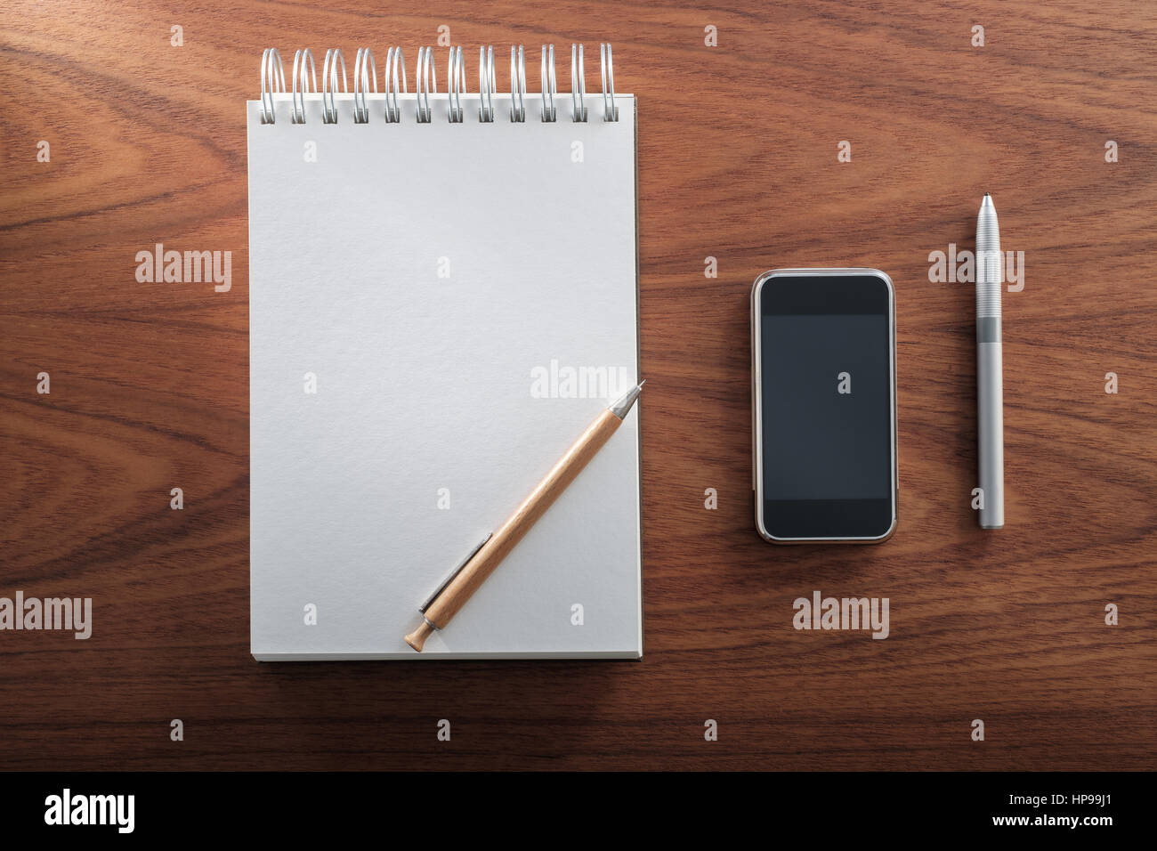 Stripped notepad and pencil vs smartphone and digital pen. Analog and ...