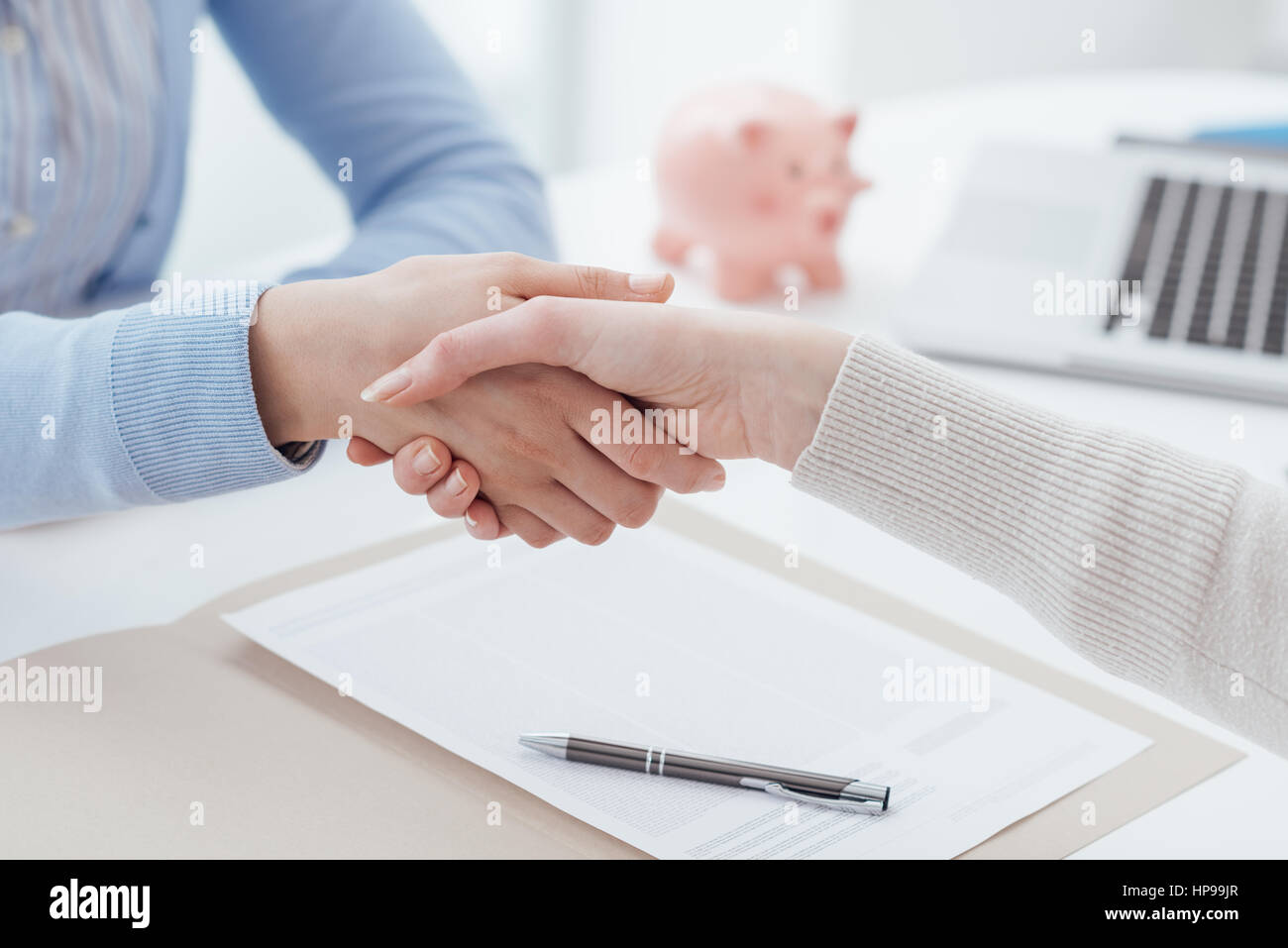 Financial advisor and customer meeting in the office and shaking hands ...