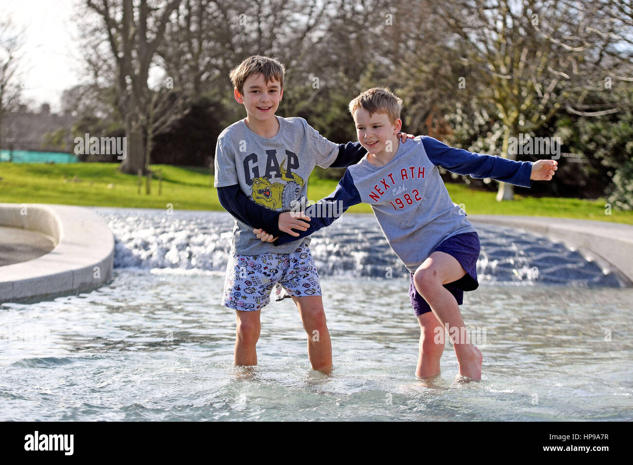 10-year-old Jacob Heal and his brother Aidan, 8, splash around in the ...