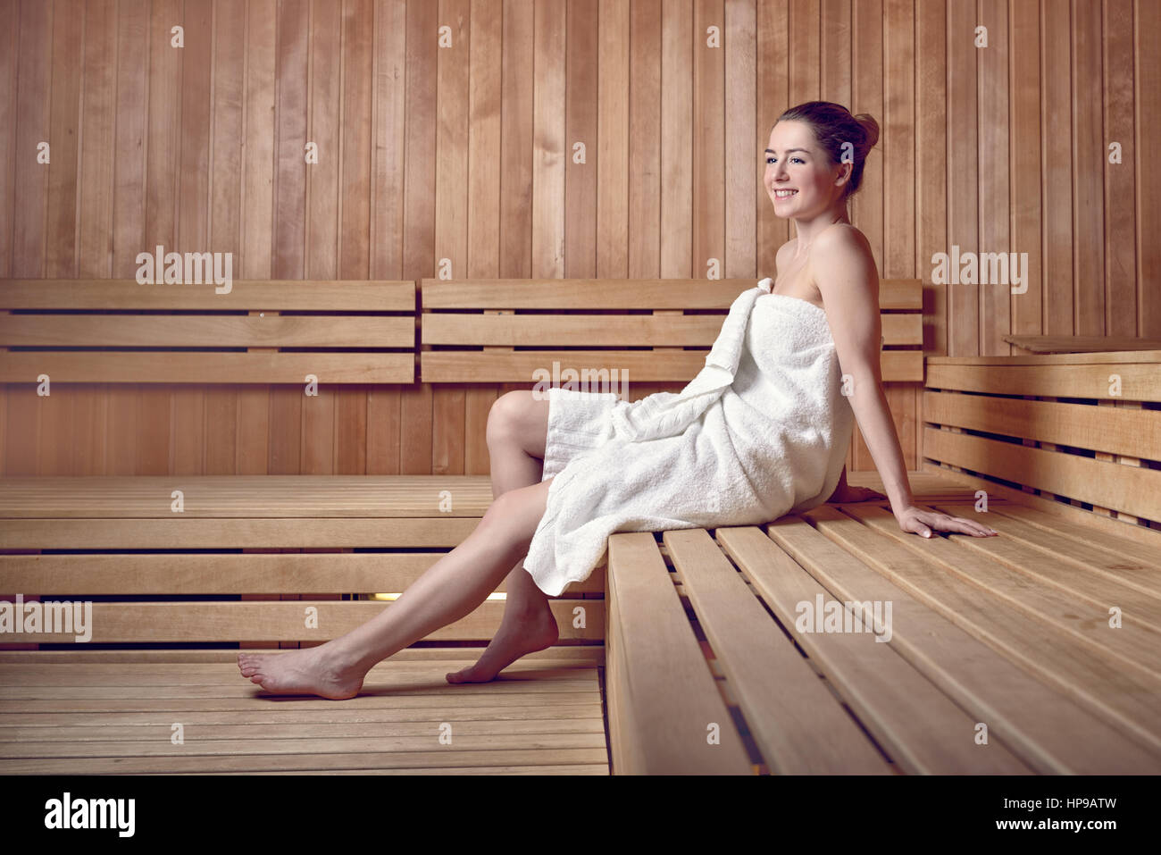 Woman wrapped in towel sauna hi-res stock photography and images - Alamy