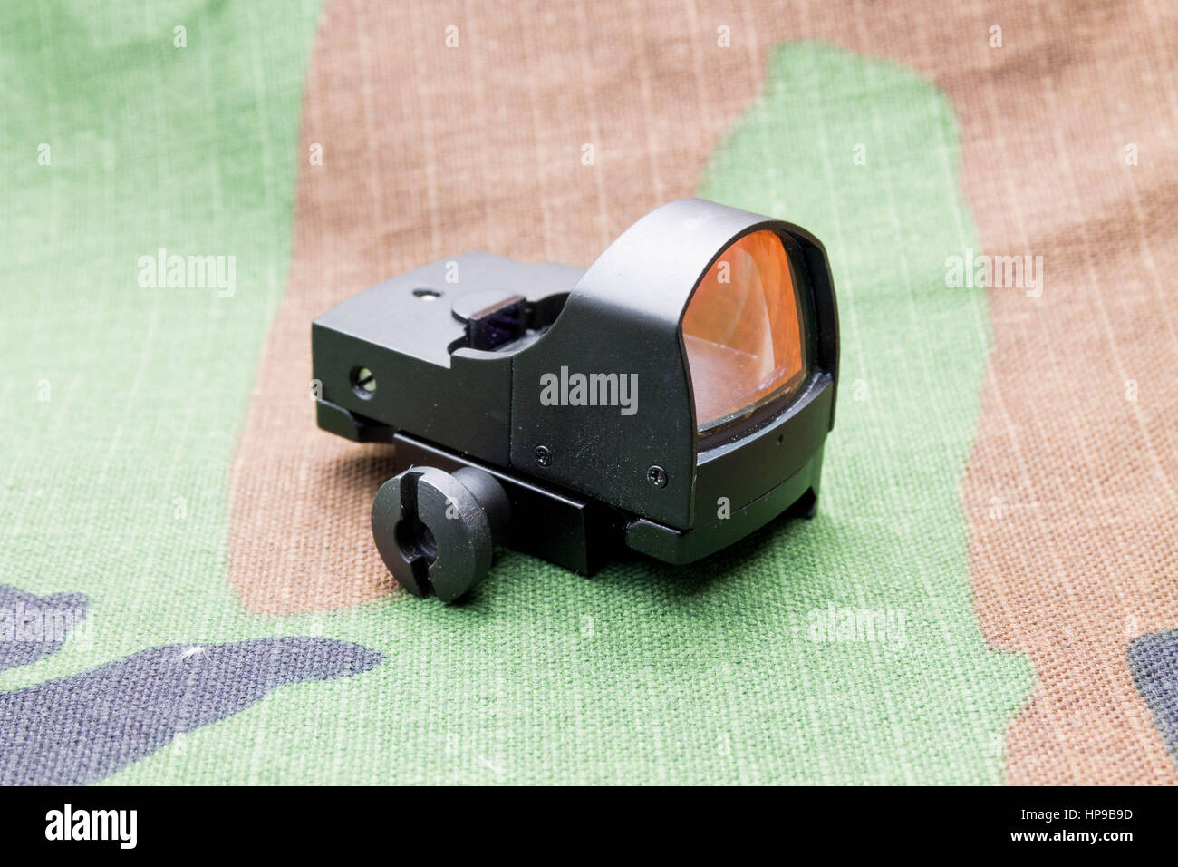Collimator sight rear view on camouflage background Stock Photo - Alamy