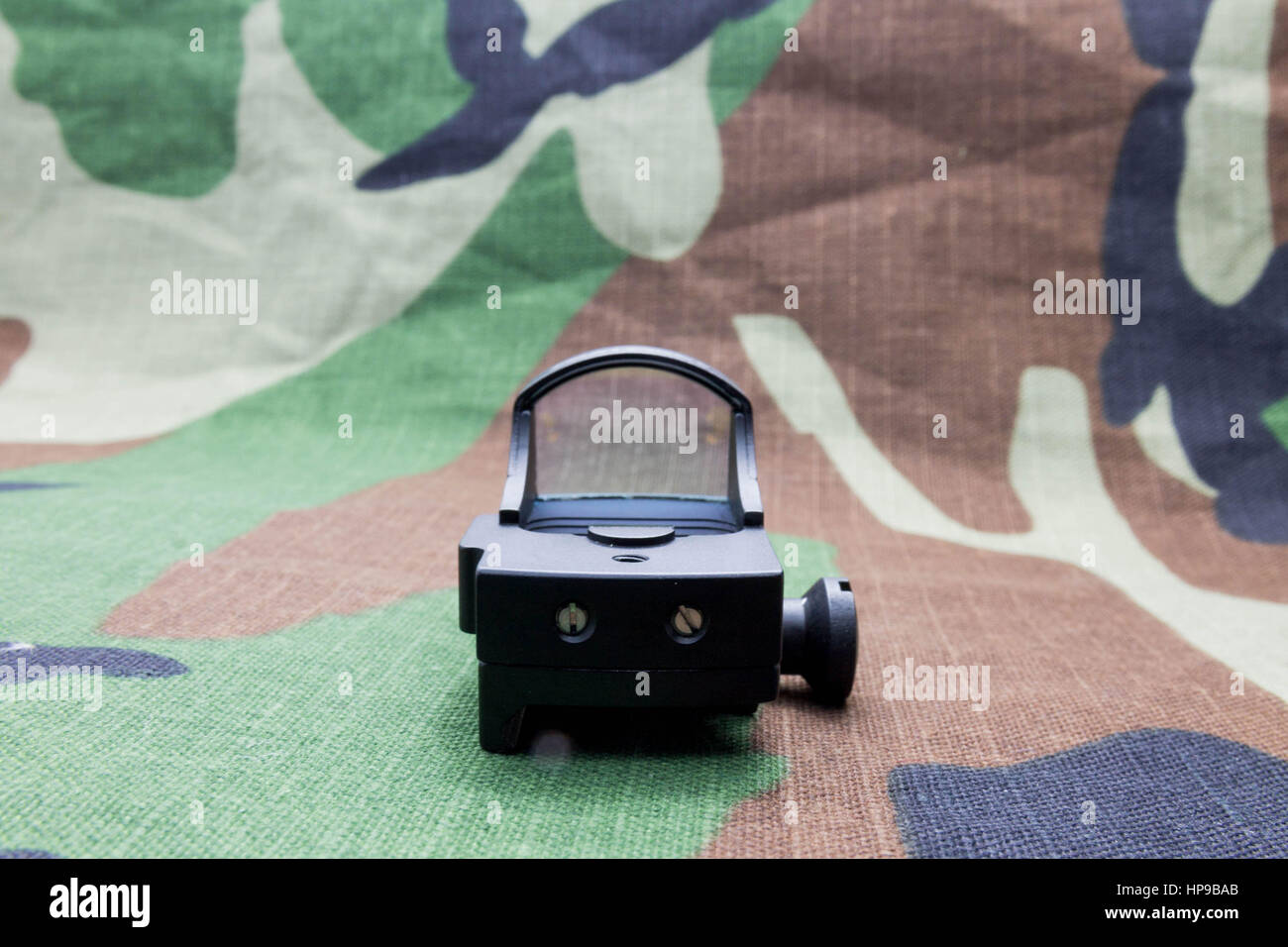 Collimator sight rear view on camouflage background Stock Photo - Alamy