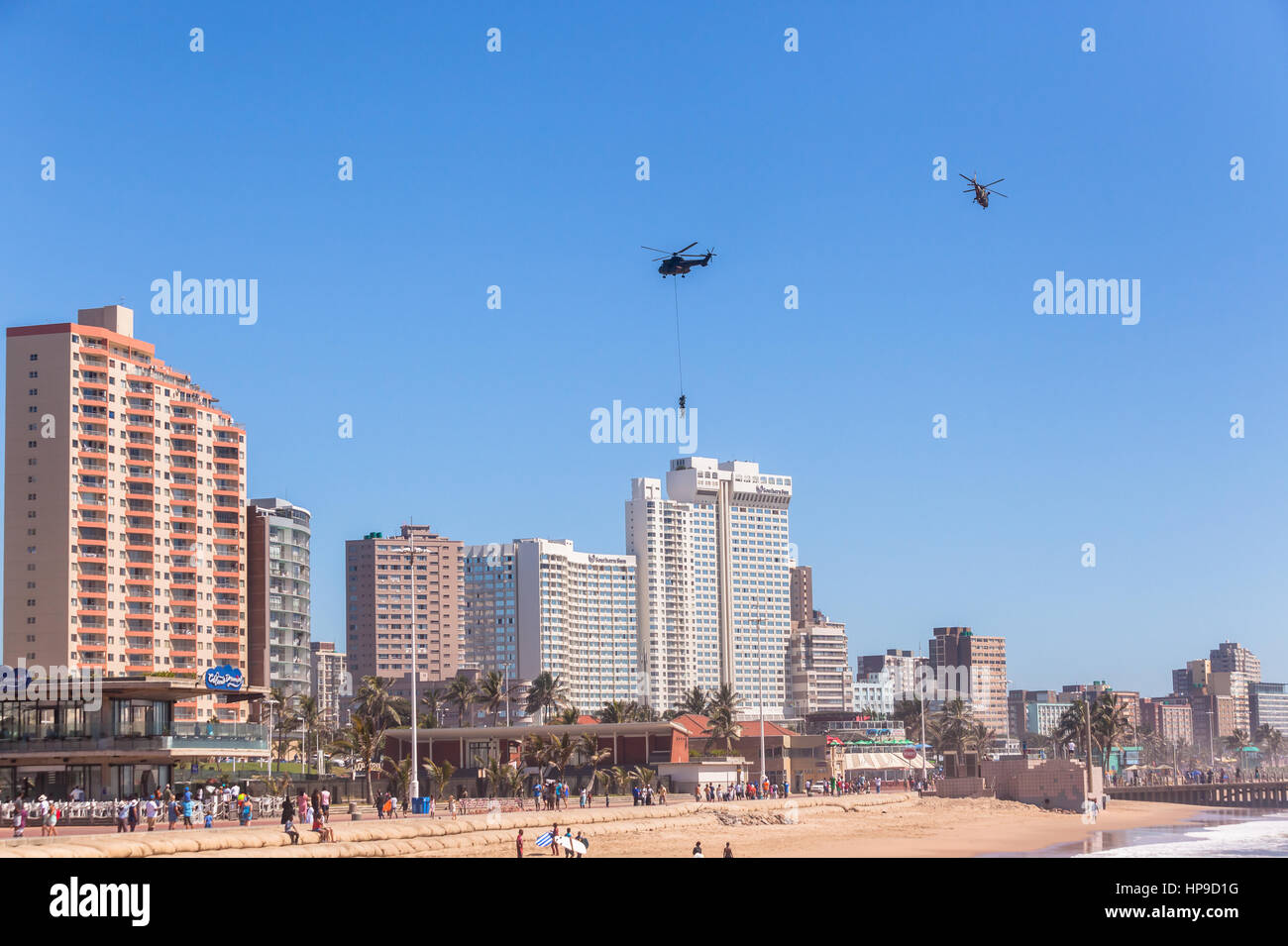 Soldiers attached to rope flying airlift below helicopter military ...