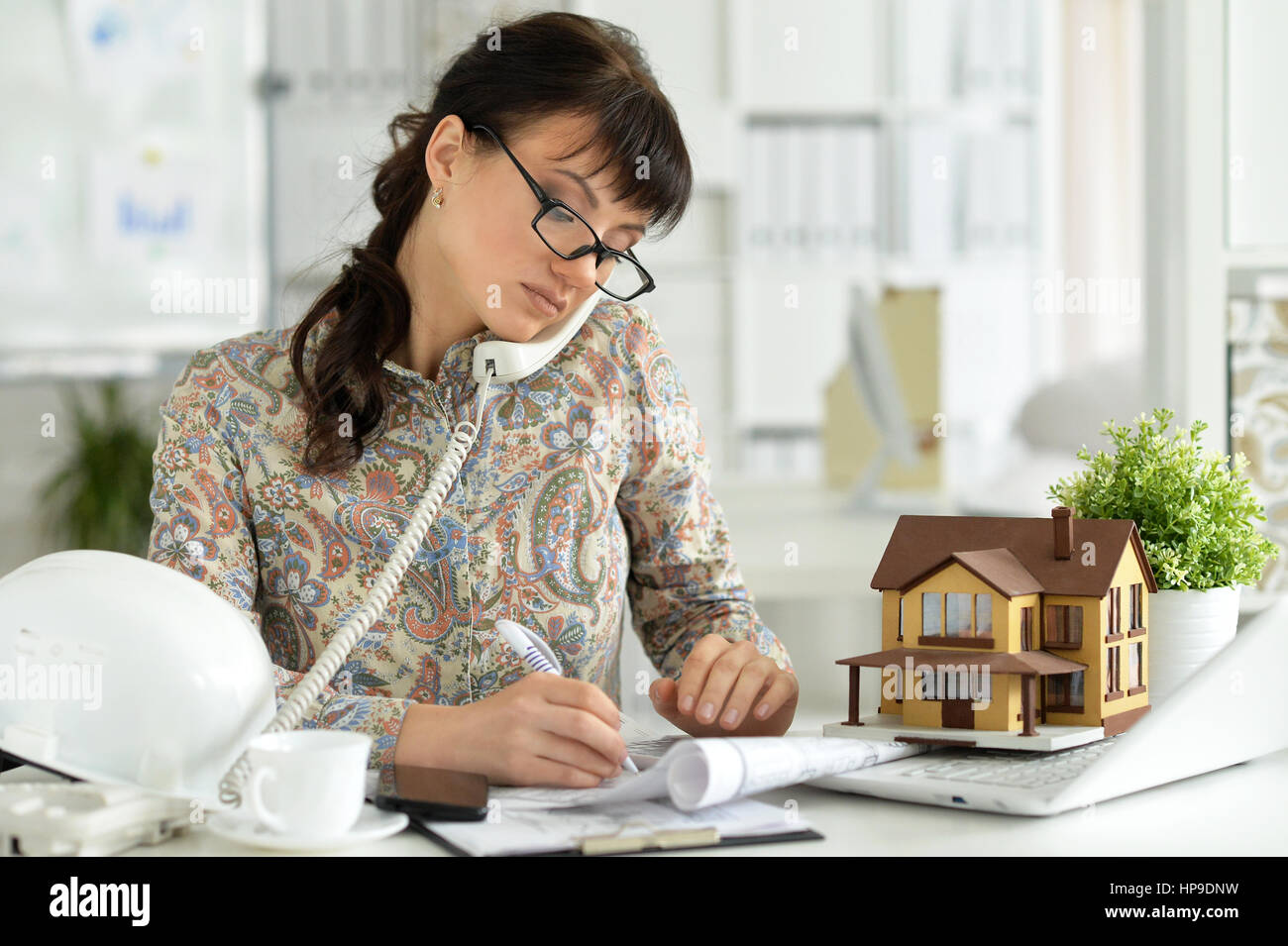 Female architect working Stock Photo - Alamy