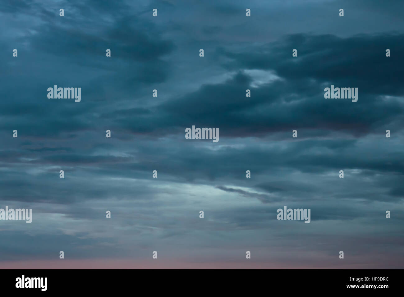 overcast gray and red evening sky for background Stock Photo - Alamy