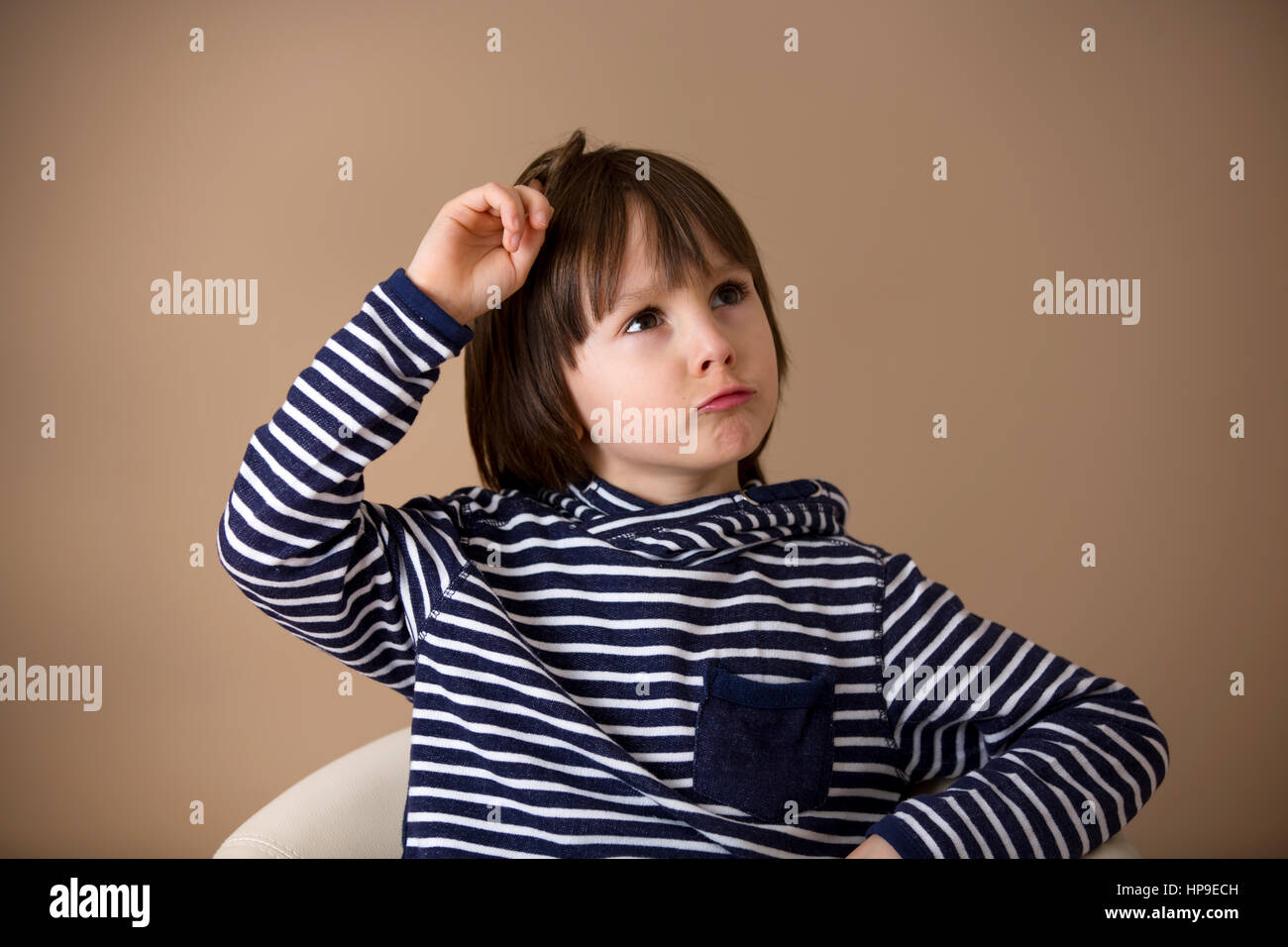Sweet preschool boy, making faces with different emotion, isolated ...