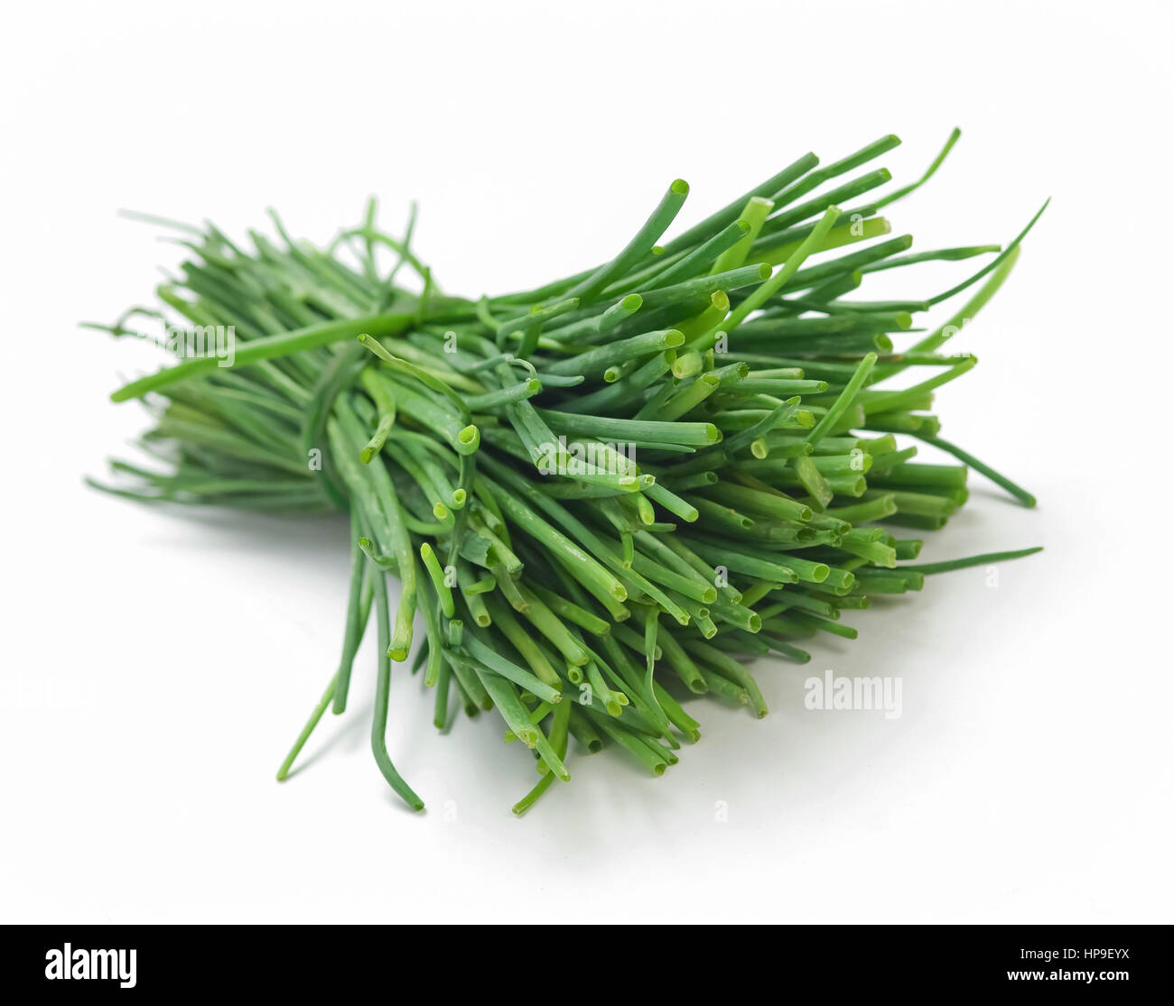 Bunch of fresh chives on white background Stock Photo - Alamy