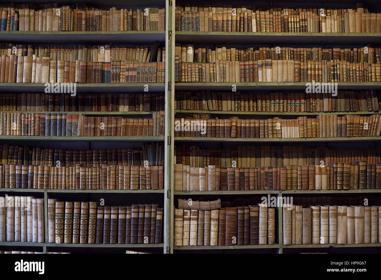 historic old books in ancient library, wooden bookshelf Stock Photo - Alamy