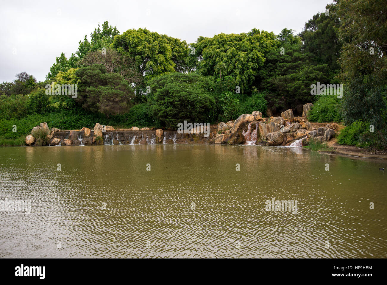 A small scenic pond with watefalls and rocks near Joondalup HBF Arena ...