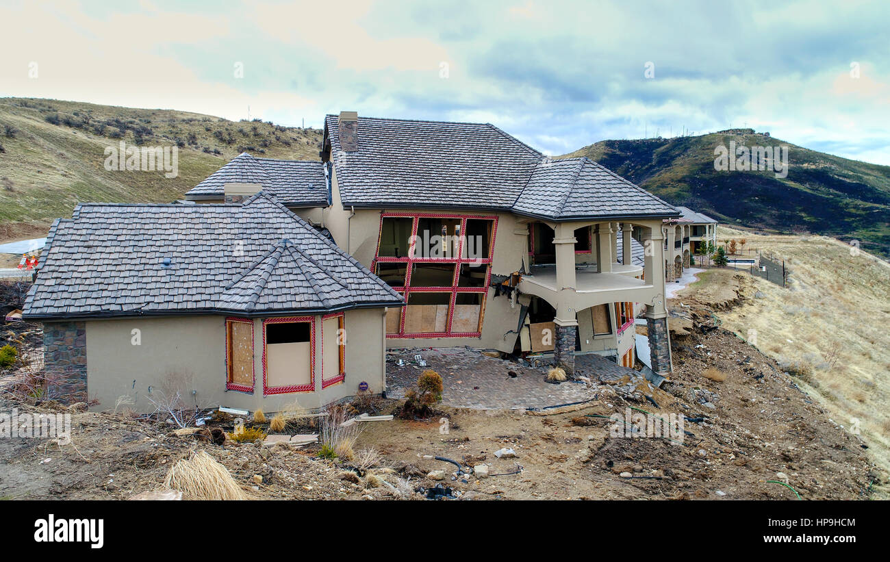 Land slide area with house going over the side of a hill Stock Photo ...