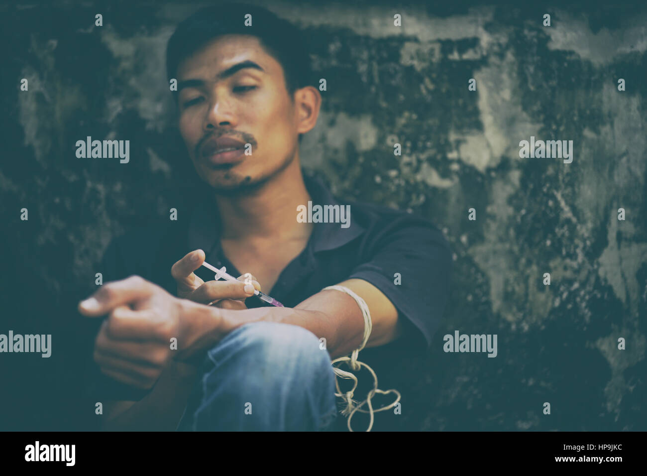 drug addict man with syringe in action Stock Photo - Alamy