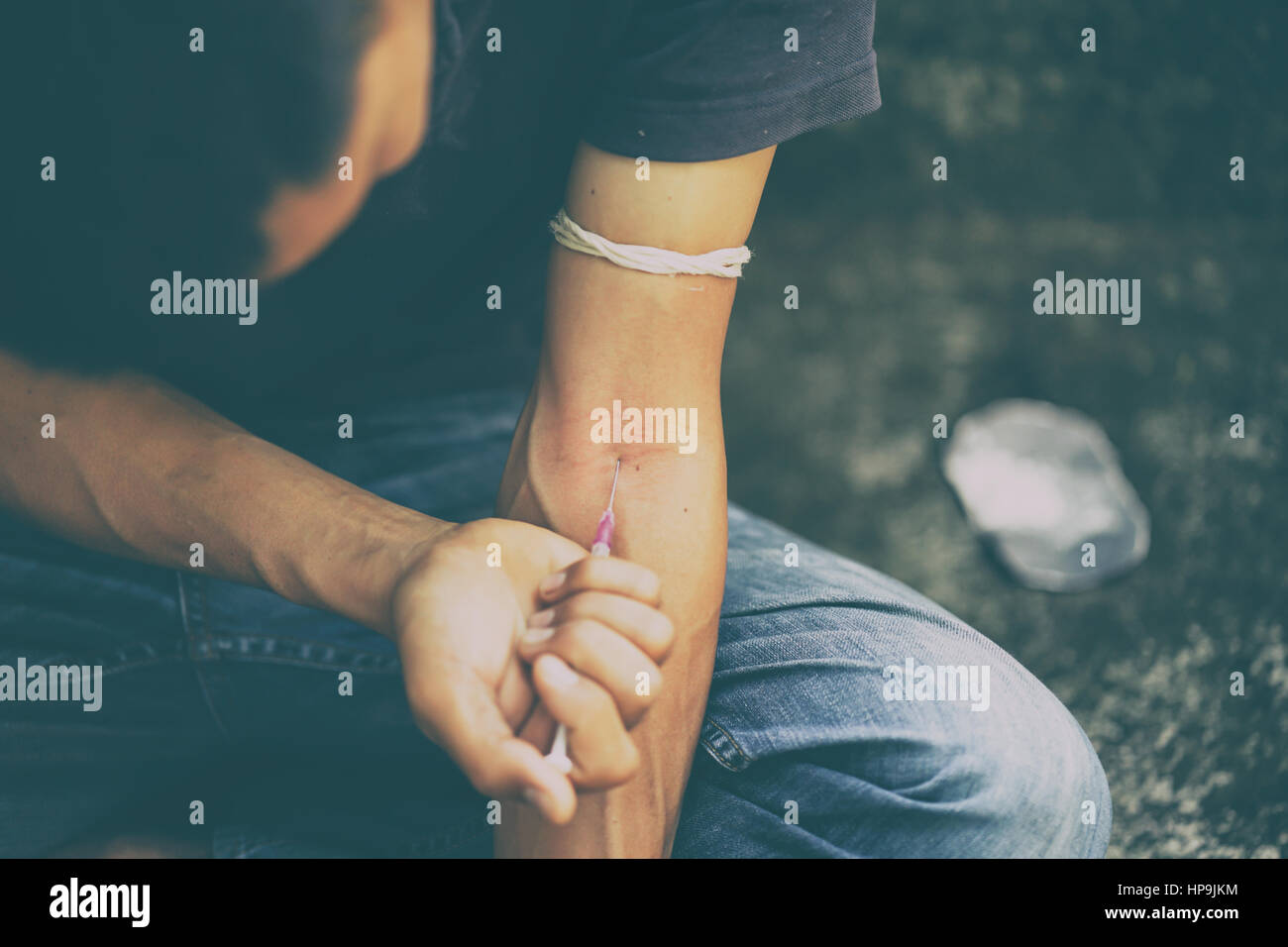 drug addict man with syringe in action Stock Photo - Alamy