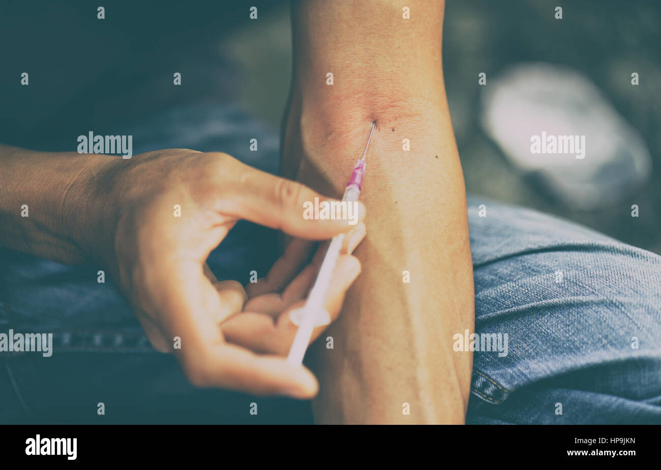 drug addict man with syringe in action Stock Photo - Alamy