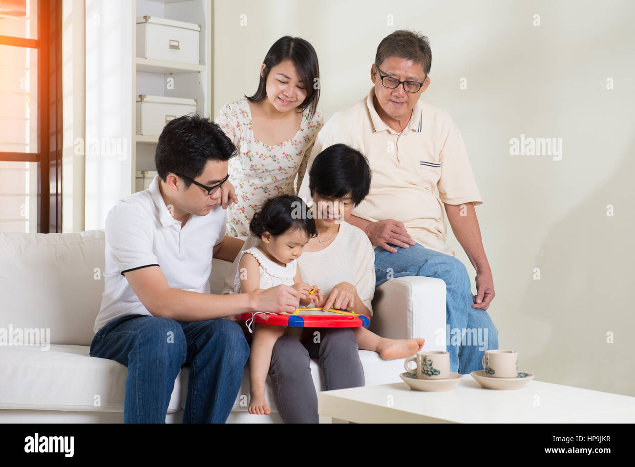 multi generation asian family at home Stock Photo - Alamy