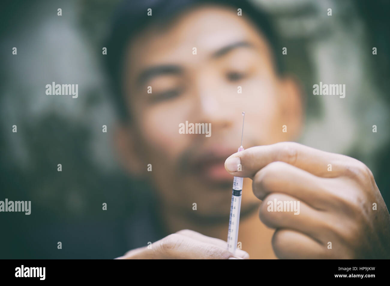 drug addict man with syringe in action Stock Photo - Alamy