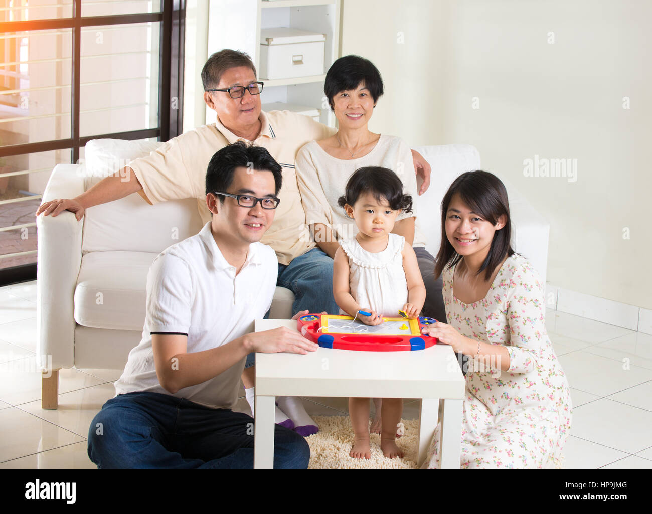 multi generation asian family at home Stock Photo - Alamy