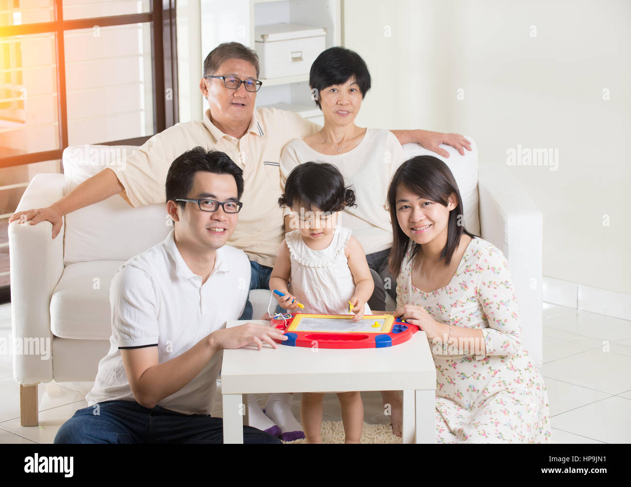 multi generation asian family at home Stock Photo - Alamy