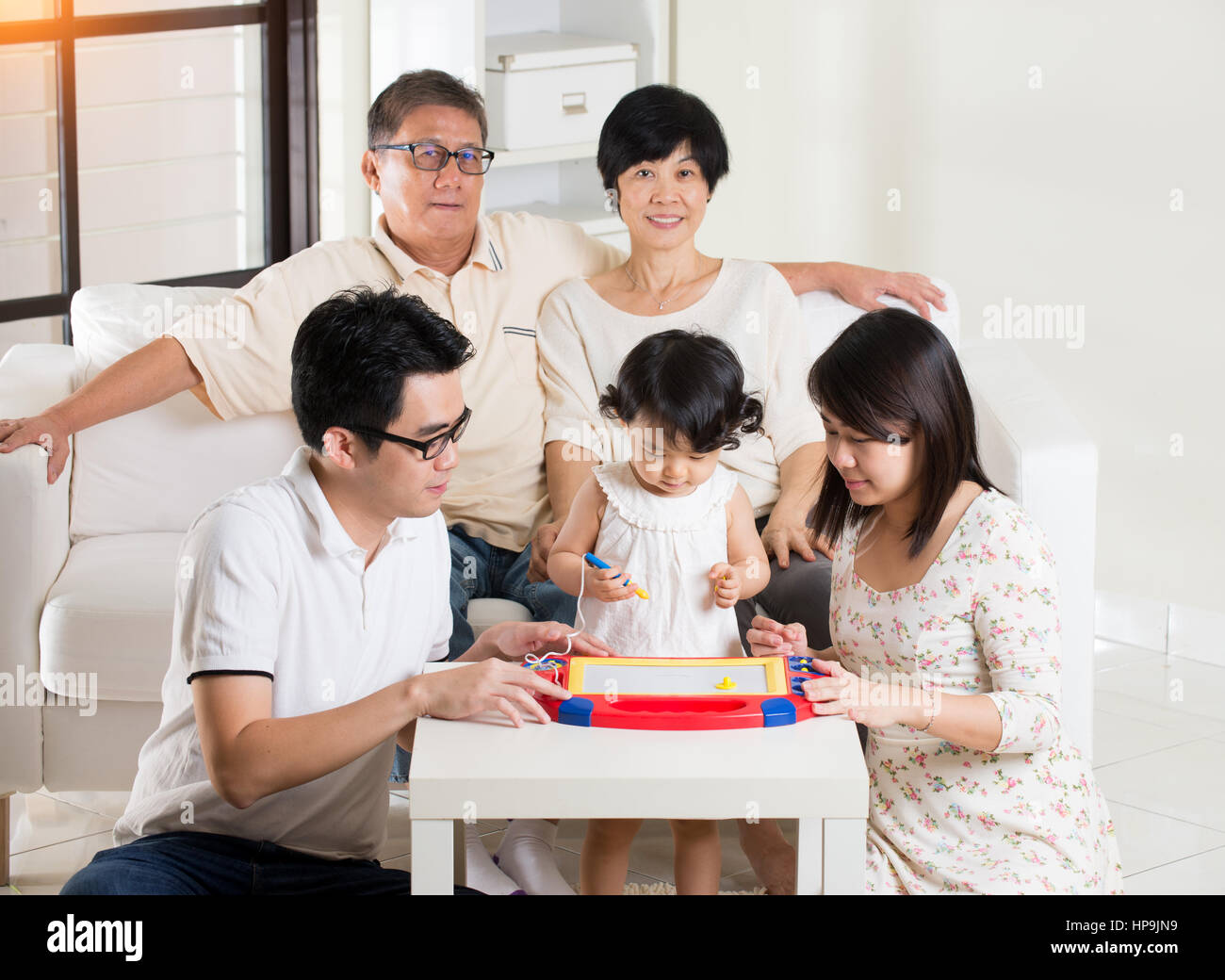 multi generation asian family at home Stock Photo - Alamy