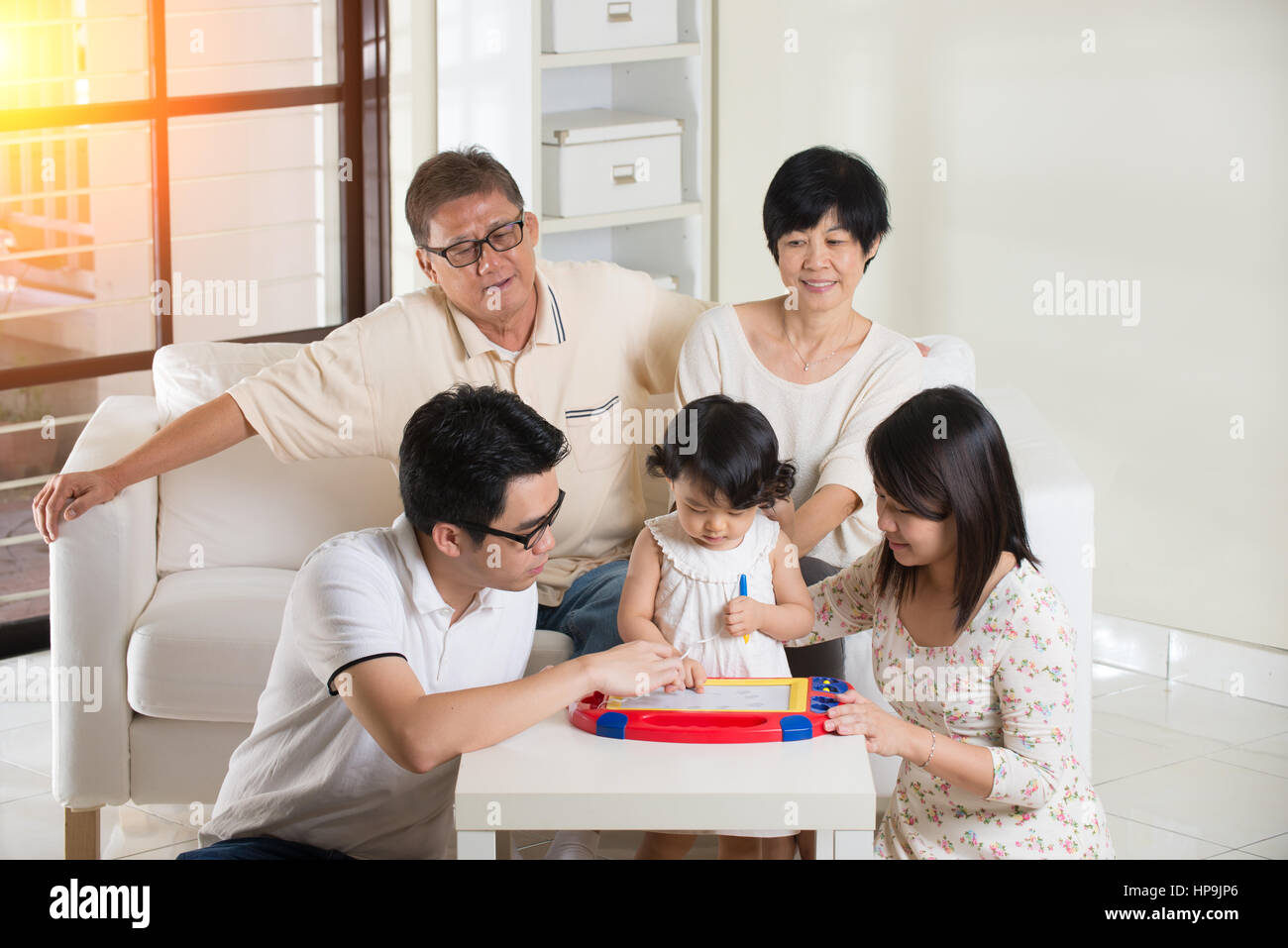 multi generation asian family at home Stock Photo - Alamy