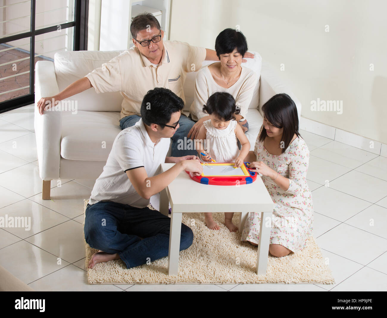 multi generation asian family at home Stock Photo - Alamy