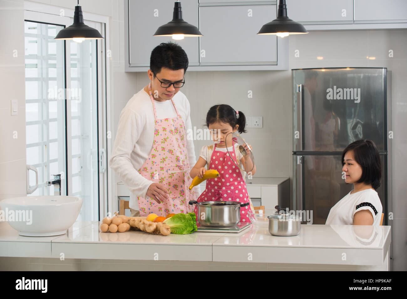 asian family cooking at kitchen Stock Photo - Alamy