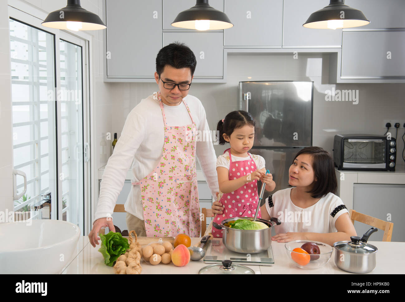 asian family cooking at kitchen Stock Photo - Alamy