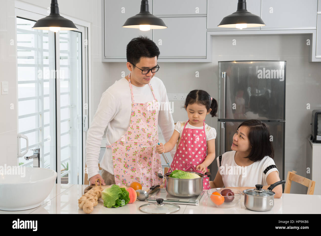 asian family cooking at kitchen Stock Photo - Alamy