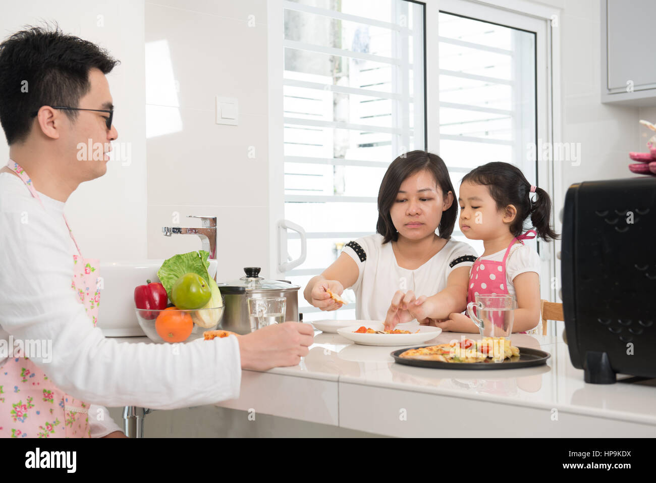 asian family enjoying and cooking pizza Stock Photo - Alamy