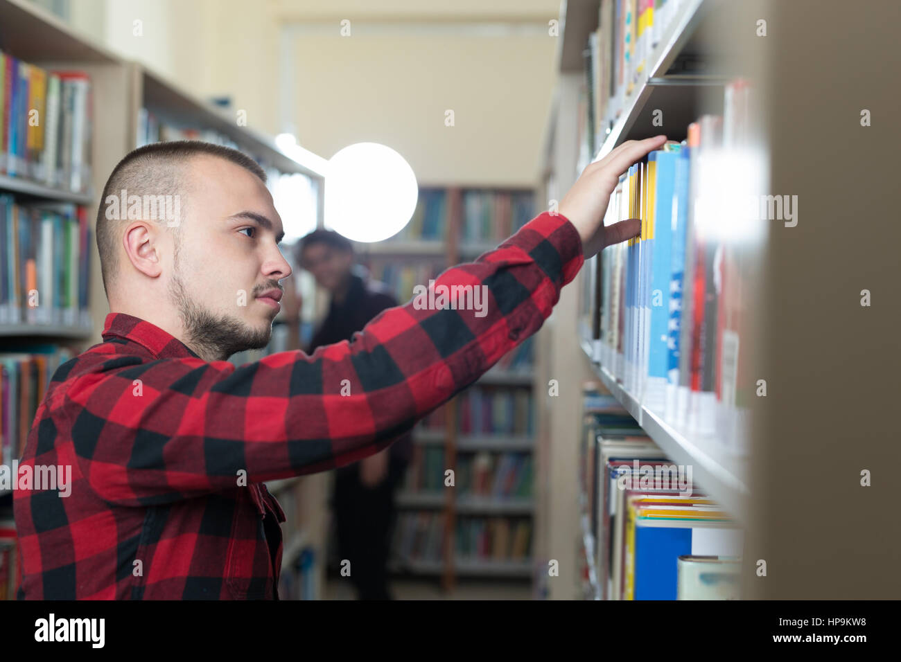 College Student, Student, Book. Student in library at university Stock ...