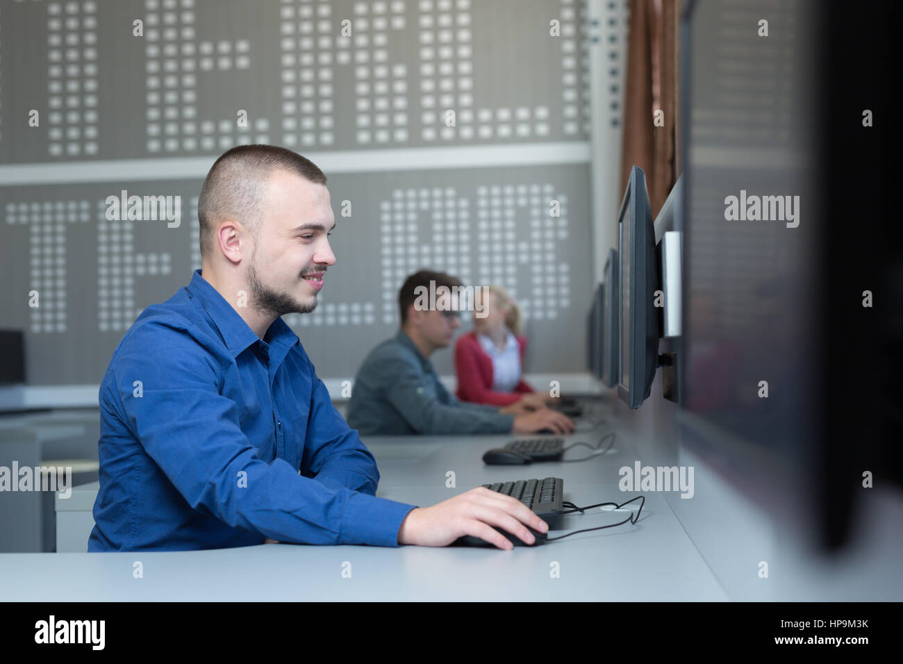 man working in the computer room at university Stock Photo - Alamy