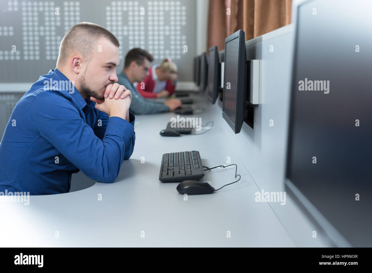 man working in the computer room at university Stock Photo - Alamy