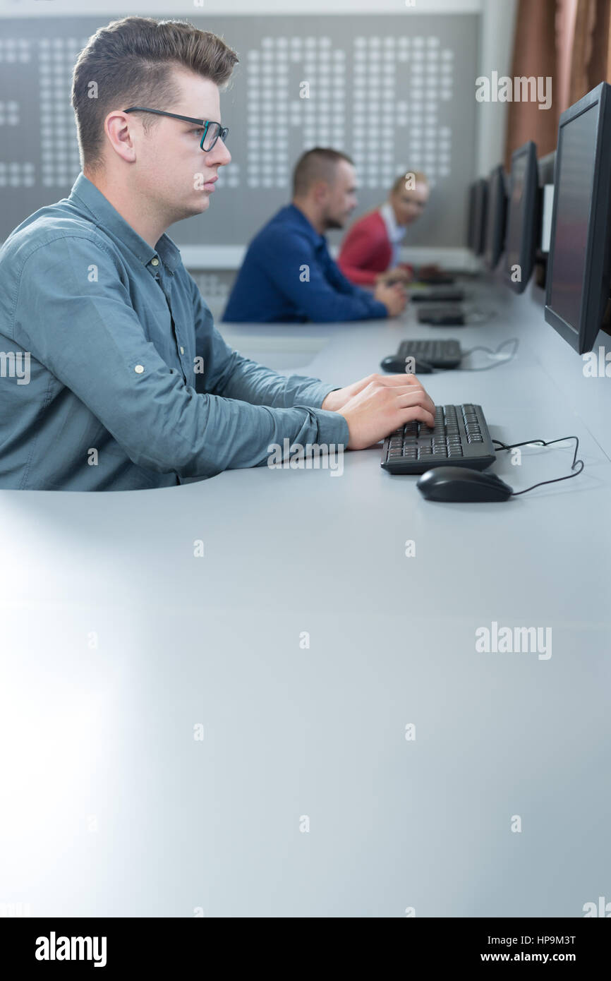 man working in the computer room at university Stock Photo - Alamy