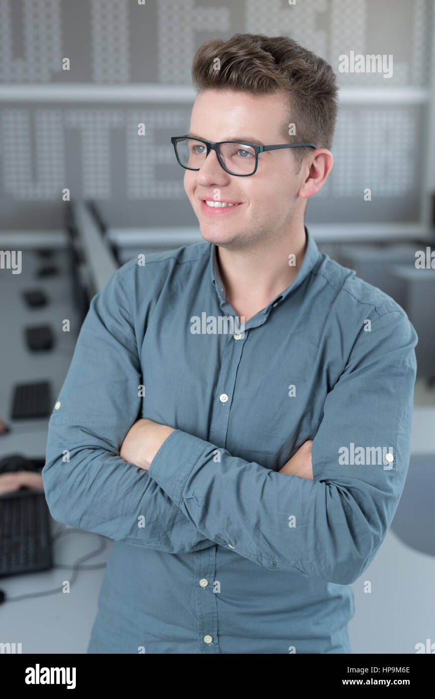 Portrait of a male student in an IT room Stock Photo - Alamy