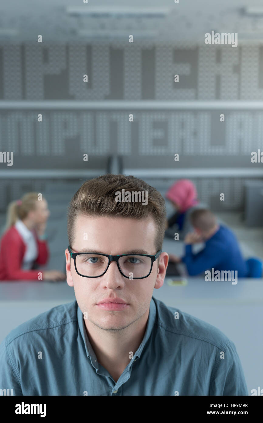 Portrait of a male student in an IT room Stock Photo - Alamy