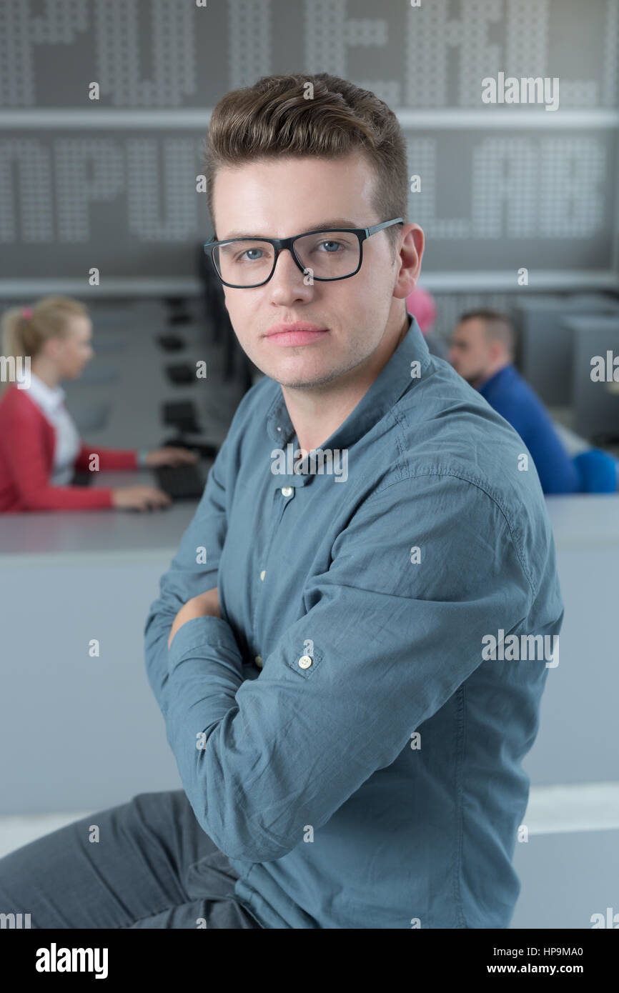 Portrait of a male student in an IT room Stock Photo - Alamy