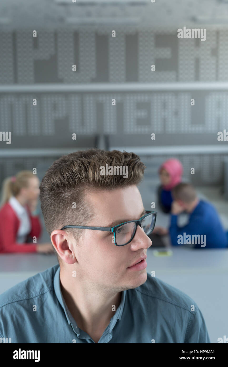 Portrait of a male student in an IT room Stock Photo - Alamy